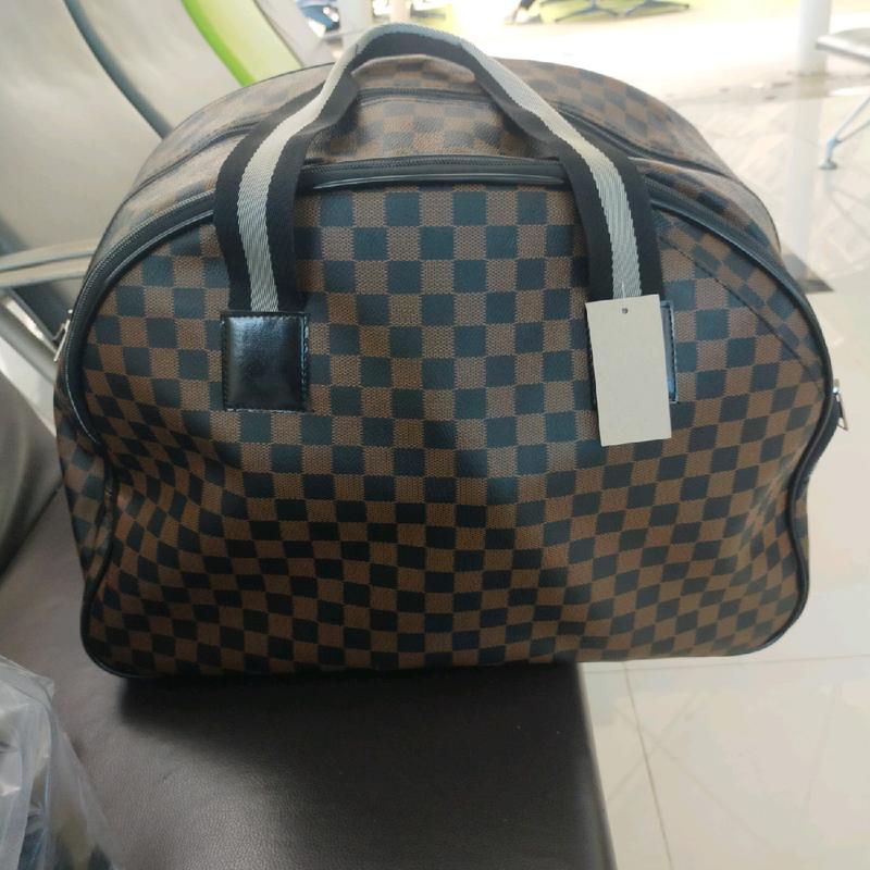 Tas Baju Kulit Sintetis Corak Viral Elle Travel - Shop | Tokopedia
